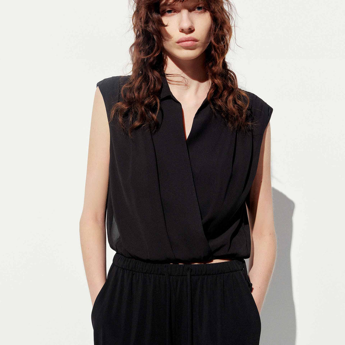 MO&Co. Women's Sleeveless Tie Hem Blouse